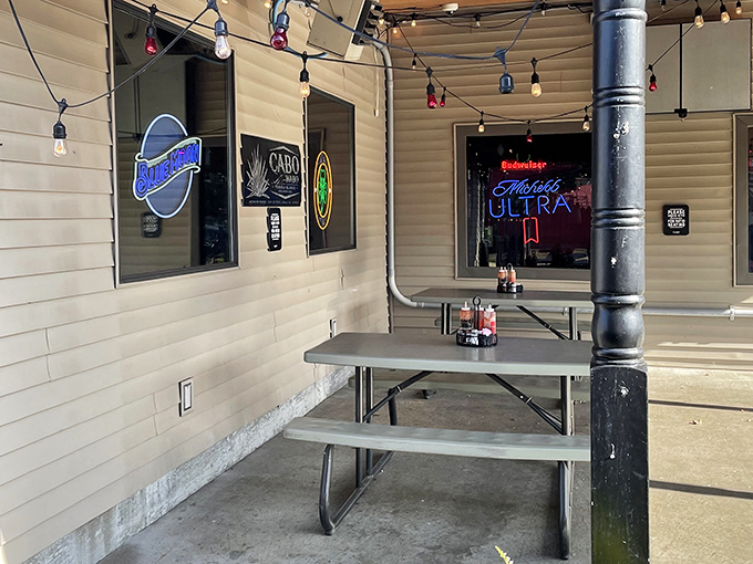 The outdoor seating area—where string lights and cold beer create the perfect setting for summer evening feasts.
