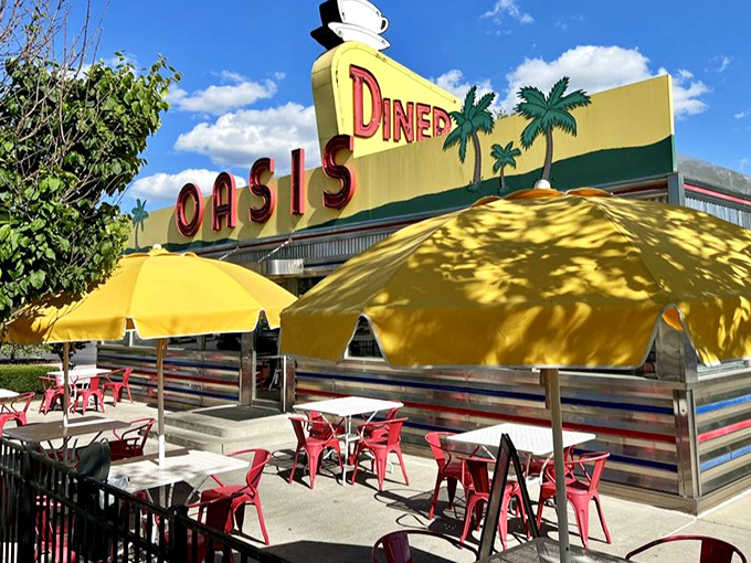 As dusk approaches, the neon signs begin to glow, transforming the Oasis Diner into a beacon for hungry travelers on the historic National Road.