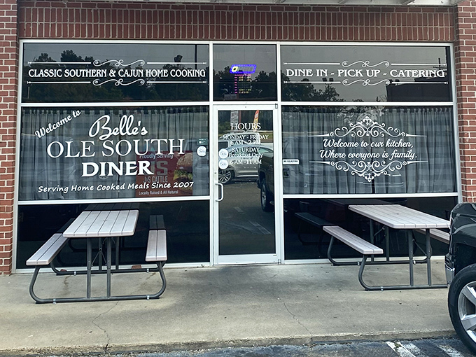 The storefront promises "Classic Southern & Cajun Home Cooking" with picnic tables standing ready for overflow crowds. Some promises are deliciously kept.