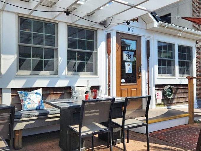 The outdoor seating area&mdash;where fresh air enhances fresh seafood. Those Adirondack chairs aren't just comfortable&mdash;they're strategic digestion stations.