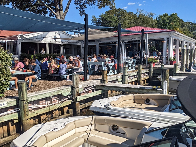 The Point's iconic sign stands sentinel over the marina, promising seafood treasures to those wise enough to follow its call.