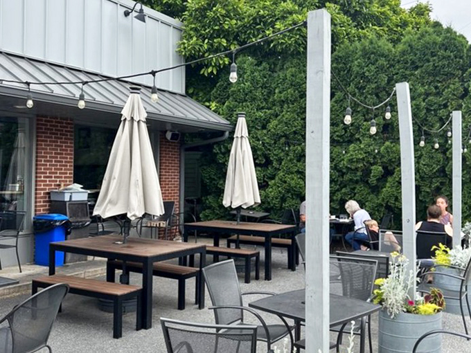 Outdoor seating that begs for lazy summer mornings. Those string lights aren't just decoration&mdash;they're permission to linger until dusk.