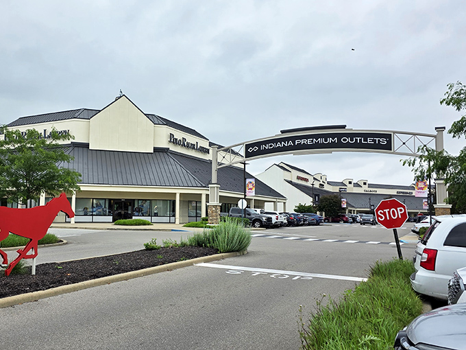 The red arrow points the way to savings, while the entrance arch welcomes you to what many consider their retail happy place.