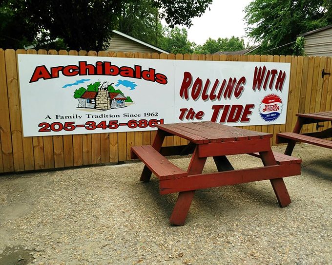 The outdoor sign and picnic table say it all: "Rolling With The Tide" and serving legendary barbecue since Kennedy was president.