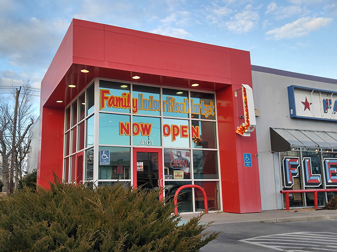 The market's distinctive red corner entrance stands out against New Mexico's blue sky, a beacon for collectors and the merely curious alike.