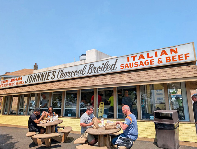 The outdoor dining experience: concrete tables, paper-wrapped treasures, and the satisfaction of a meal worth waiting for.