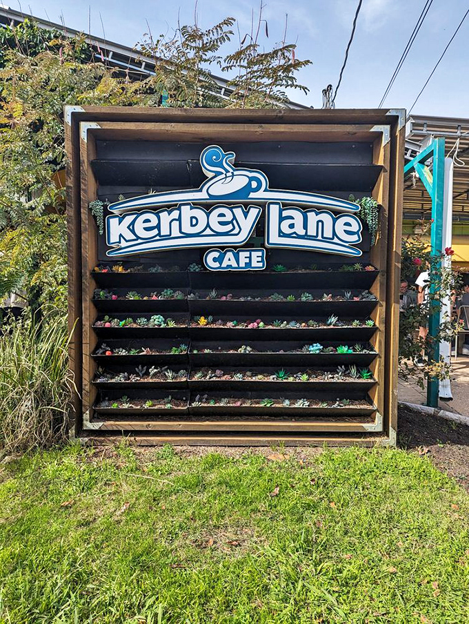 The sign stands as a succulent-adorned sentinel, guarding the gateway to breakfast bliss.