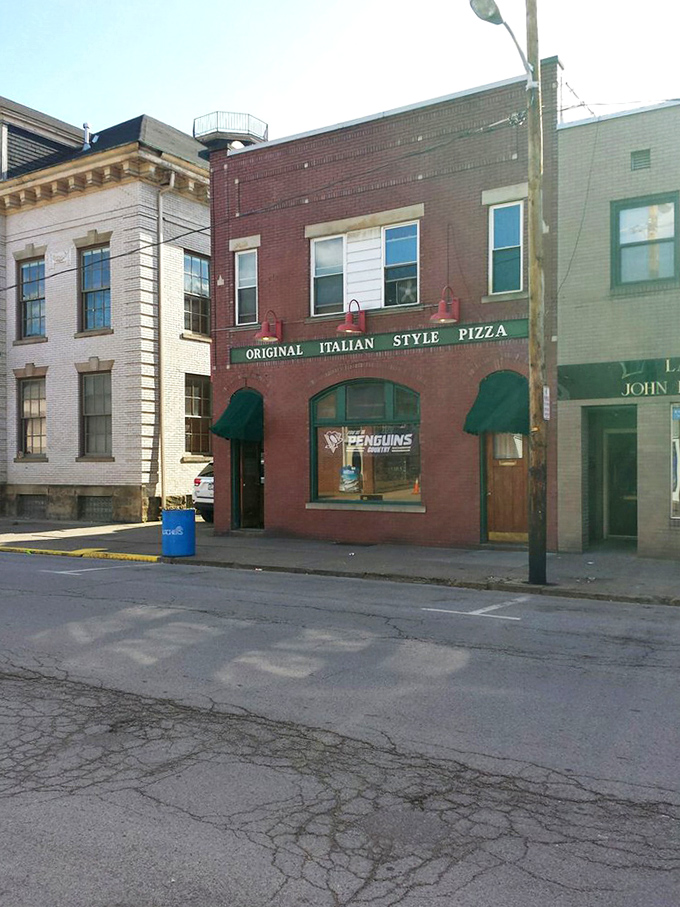 From the street, it looks unassuming, but locals know this former police station now enforces only one law: exceptional pizza.