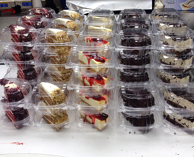 Sweet temptations lined up like soldiers&mdash;cheesecake, chocolate cake, and other treats standing by for dessert duty.