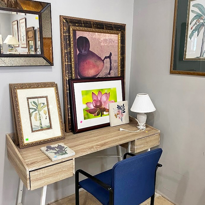 An art corner where someone else's "it doesn't match our new couch" becomes your "perfect statement piece" for half the gallery price.