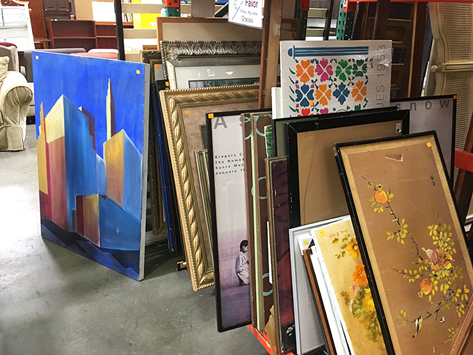 The art section resembles a gallery where abstract cityscapes and delicate florals wait patiently for walls that need their particular magic.