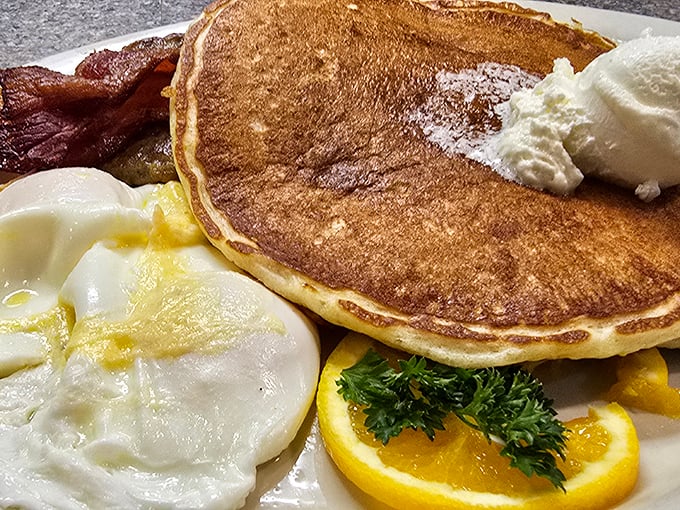 Pancakes so perfectly golden they belong in a breakfast hall of fame, with eggs sunny enough to brighten even Monday mornings.