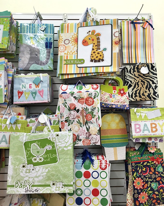 Gift bags for every occasion imaginable, because wrapping paper still defeats most adults regardless of age or education.