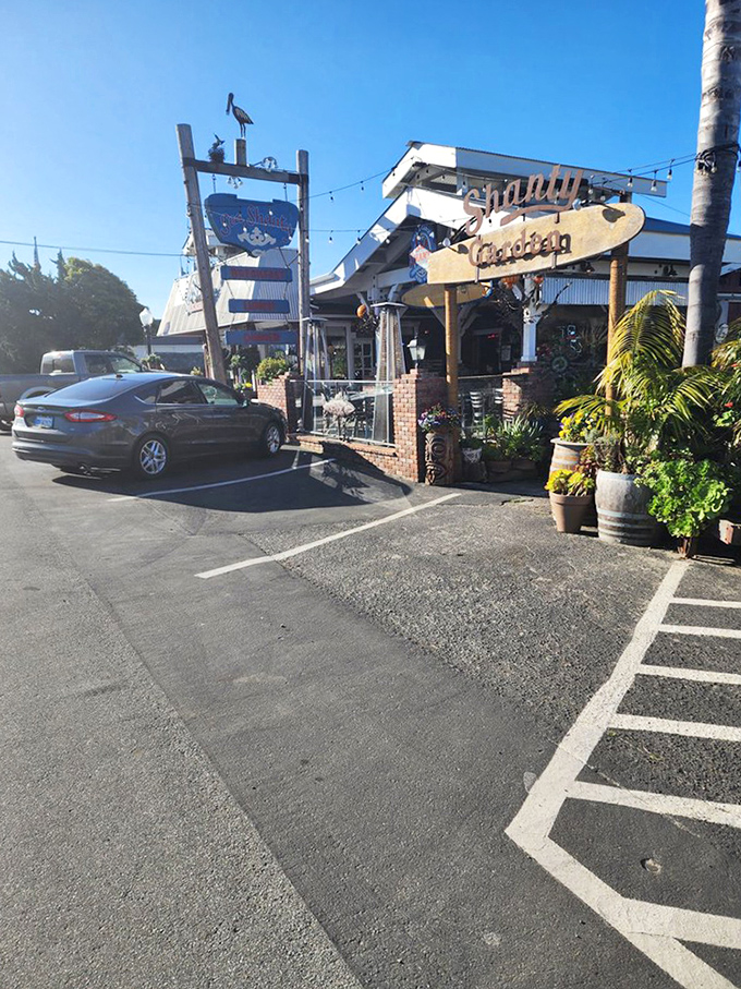 The parking lot&mdash;where anticipation begins and food comas end. That vintage sign promises coastal comfort far beyond what your GPS description suggested.