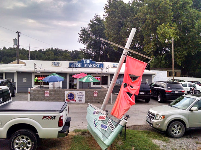 The parking lot view reveals the restaurant's modest footprint &ndash; proof that culinary greatness doesn't require fancy real estate, just passion and good recipes.