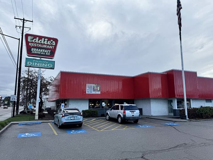 Even on cloudy days, Eddie's red exterior stands out like a beacon of breakfast hope in the parking lot.