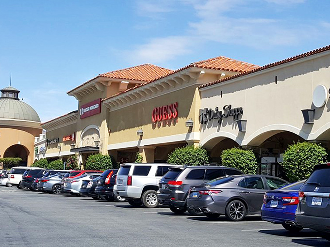 Guess and other luxury brands beckon from their Spanish-style storefronts &ndash; retail therapy with architectural flair.