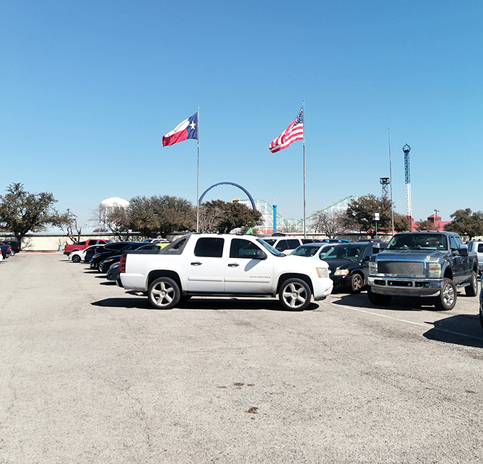 The sprawling parking lot flies both Texas and American flags, a patriotic reminder that bargain hunting is practically a constitutional right.