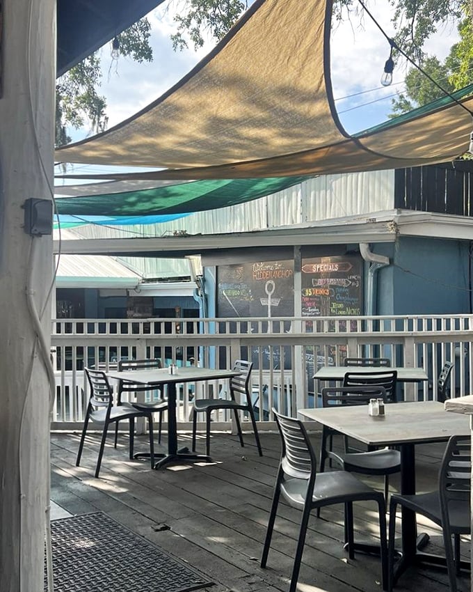 The outdoor patio offers shelter from both sun and responsibilities, where lunch can lazily stretch into afternoon without anyone checking their watch.