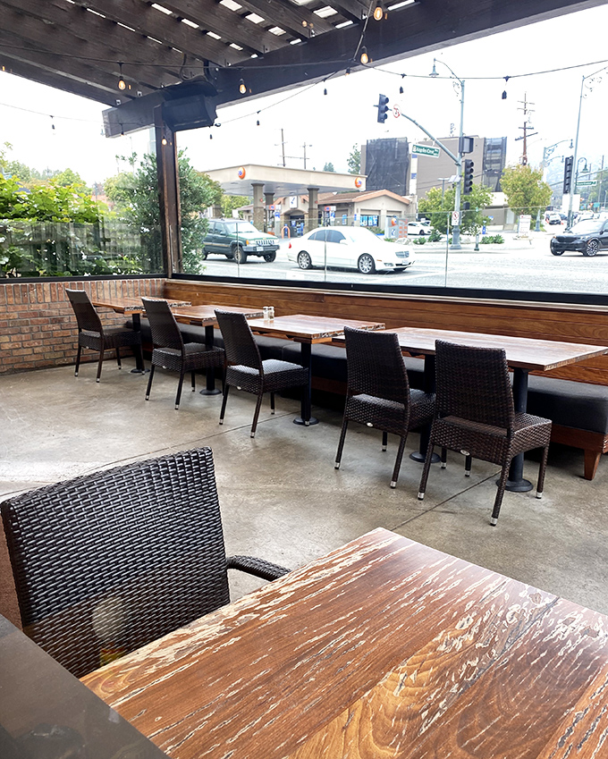 Patio seating with a view of La Ca&ntilde;ada life passing by. The perfect spot for people-watching while enjoying your bacon avocado burger in the California sunshine.