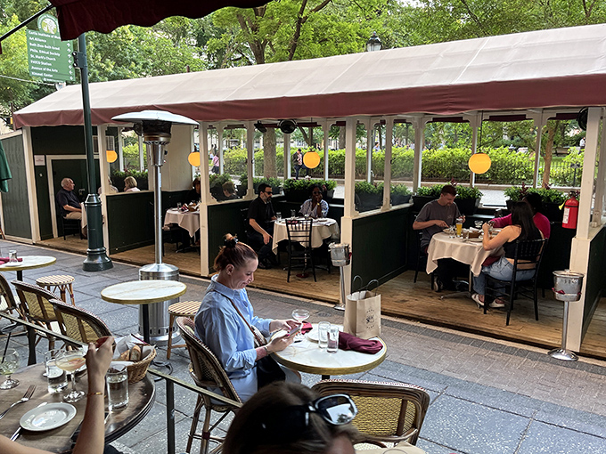 Outdoor dining with a side of people-watching. Those canvas coverings aren't just for shade&mdash;they're the sails of your culinary voyage to France.