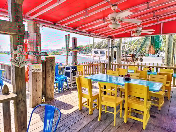 Waterfront dining at its most colorful! Fishy Fishy's vibrant yellow chairs and turquoise tables create the perfect backdrop for seafood feasting with a view.