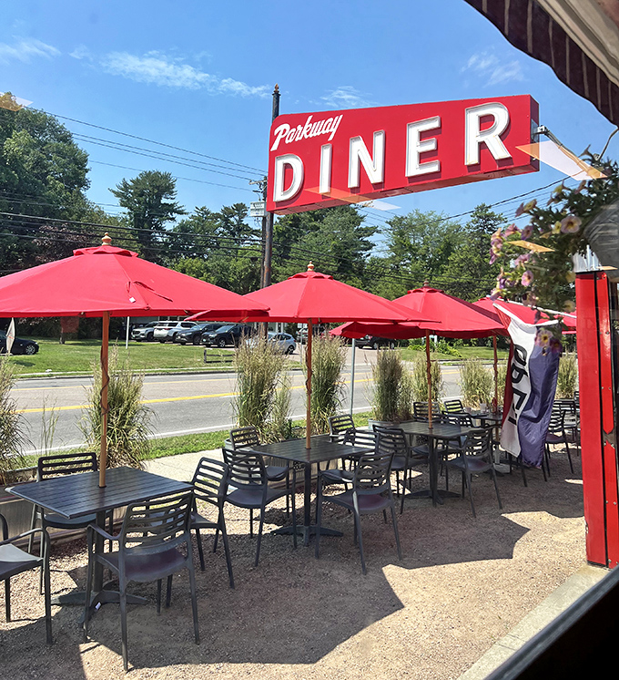 Summer dining under Parkway's red umbrellas&mdash;where Vermont's fresh air somehow makes those Benedicts taste even better.