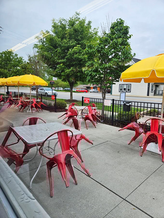 The outdoor patio where red metal chairs pop against yellow umbrellas&mdash;a cheerful oasis for enjoying your meal while watching the world roll by on the historic National Road.