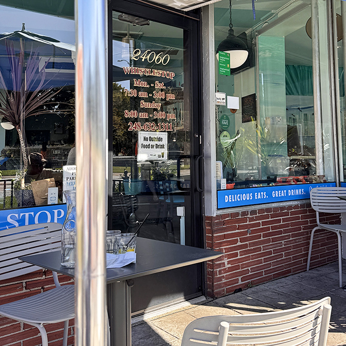 The door promises "Delicious Eats, Great Drinks" with the confidence of someone who knows they're not just making breakfast&mdash;they're creating memories.