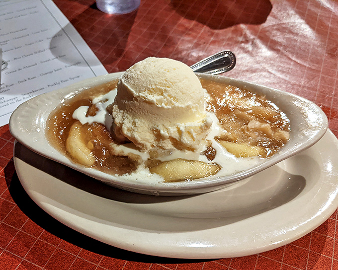 Apple cobbler &agrave; la mode: where warm fruit meets cold ice cream in a temperature tango that makes your taste buds want to dance along.