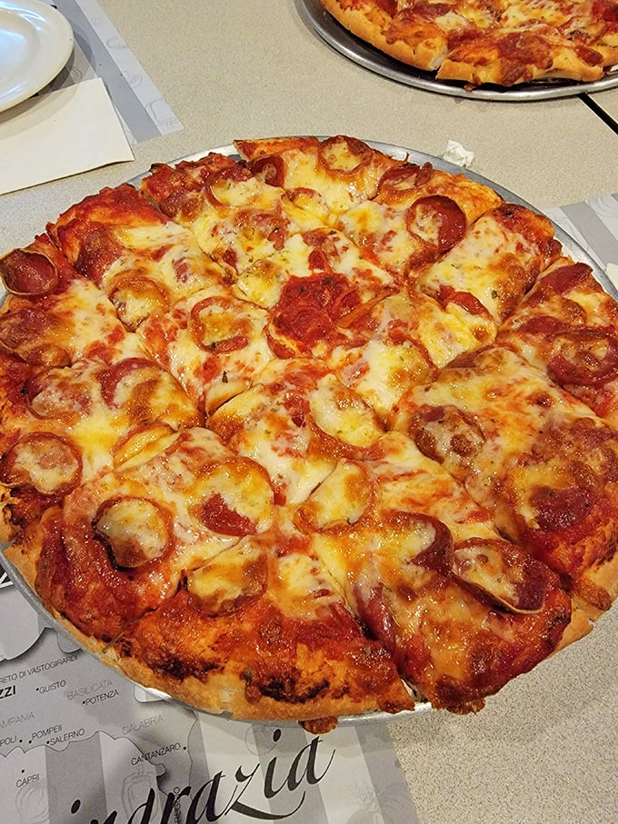 Classic pepperoni pizza with those crispy-edged slices that curl up just right, like edible smile emojis.