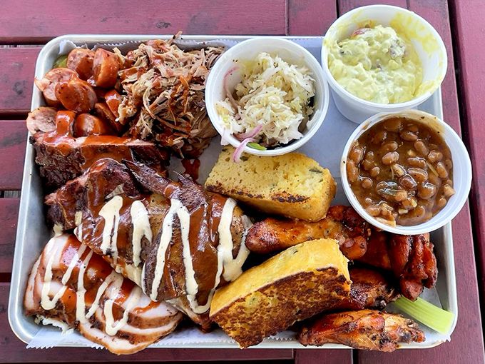 The sampler platter that answers life's most important question: "Why choose one meat when you can have them all?" The cornbread is non-negotiable. 