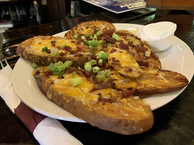 Loaded potato skins that prove sometimes the simplest pleasures – cheese, bacon, potato – create the most profound satisfaction.