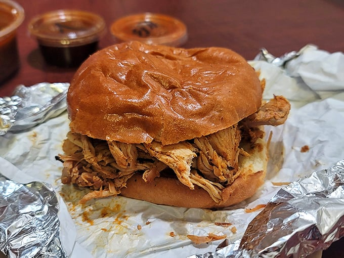 A pulled pork sandwich that makes you question every other sandwich you've ever committed to. The bun is just transportation for what really matters.