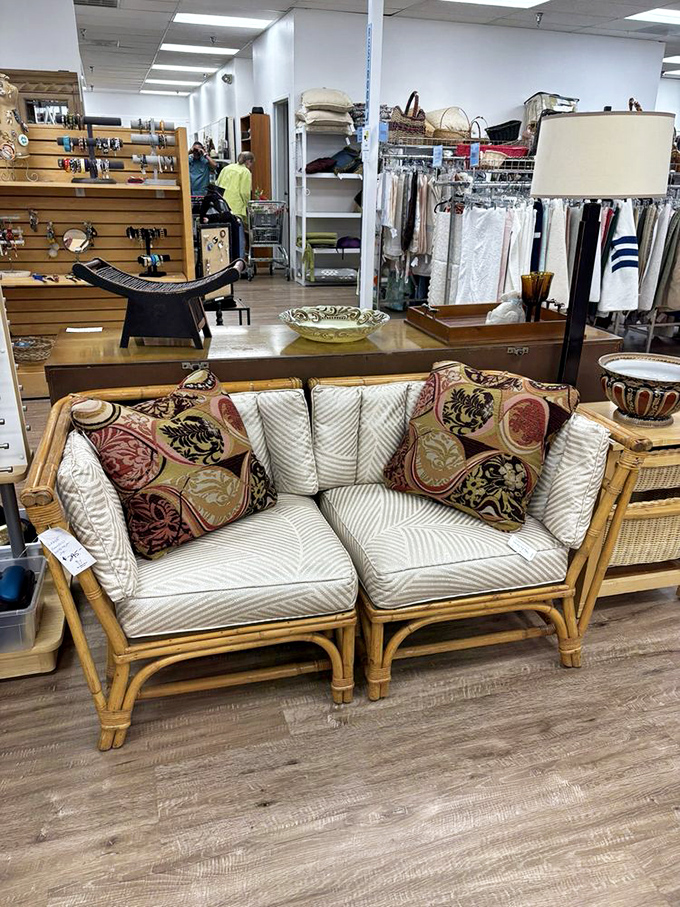 A rattan loveseat that whispers "tropical getaway" without shouting "1980s Florida room." Pair with a piña colada for maximum effect.