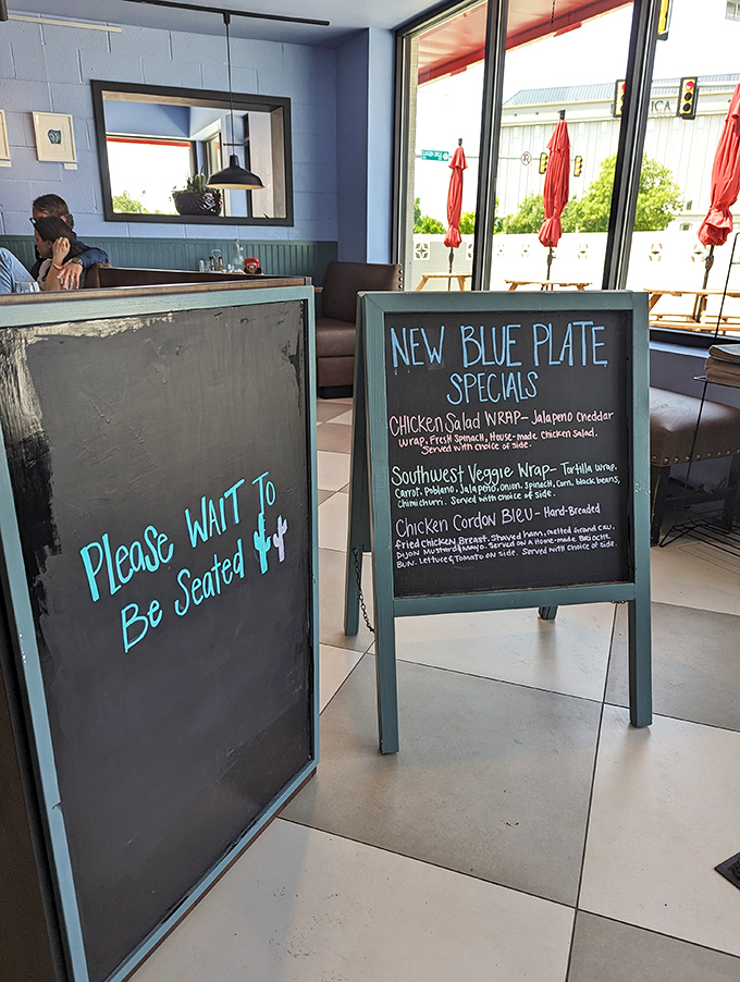 Please Wait To Be Seated isn't just a sign, it's a promise that good things come to those willing to pause for culinary greatness.