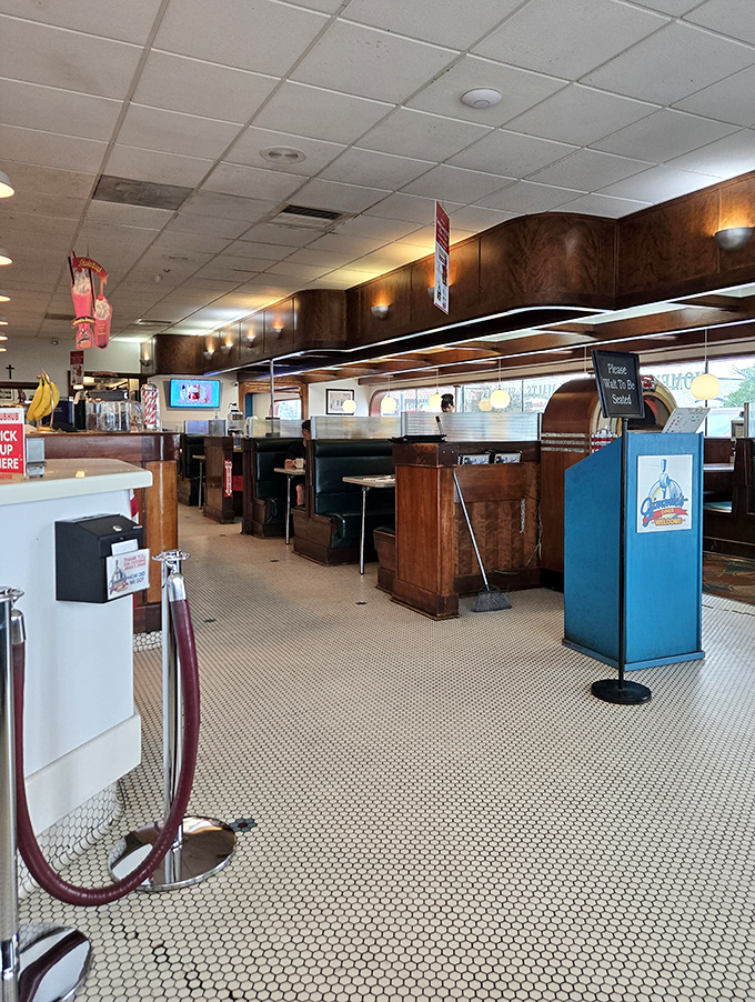 Classic diner design that whispers, "We've been doing this right for decades." Those hexagon floor tiles have seen generations of happy diners.