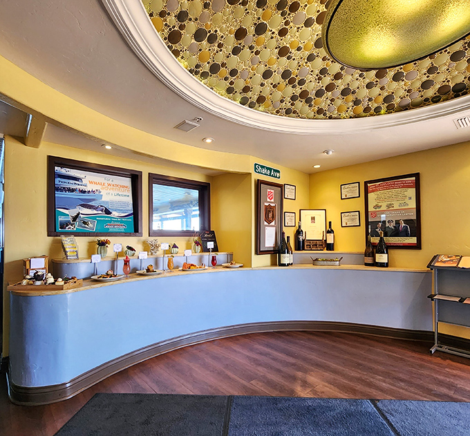 The reception area's curved counter and bubble-textured ceiling create a first impression that says, "Yes, we take seafood seriously, but we're still fun."
