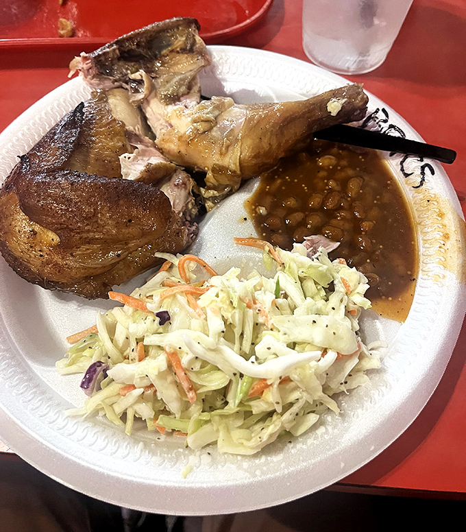 Smoked chicken that's lived its best life, now fulfilling its destiny alongside creamy slaw and beans.