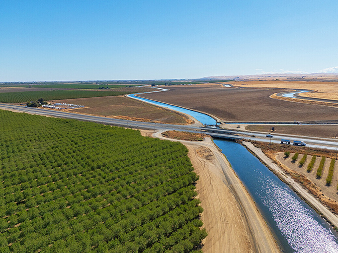 Irrigation canals crisscross farmland like blue veins, the lifeblood of an agricultural community where water rights discussions are taken very seriously.