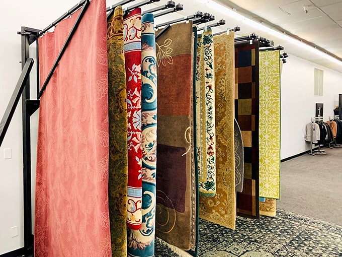 A rainbow of rugs hanging like exotic tapestries in a sultan's palace, except here you can actually take them home without diplomatic negotiations.