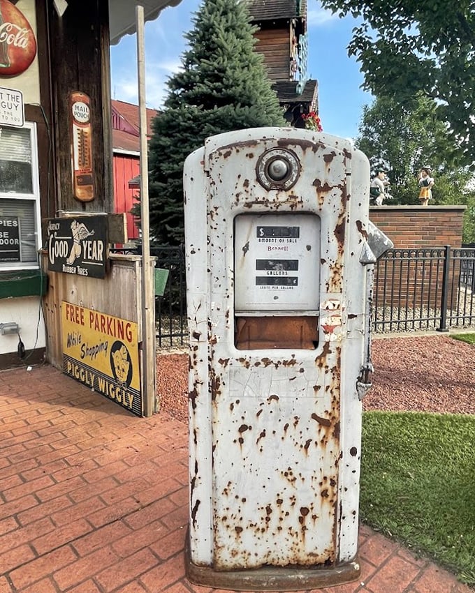 This vintage gas pump stands as a rusty sentinel of bygone road trips, when filling stations had personality instead of touchscreens.