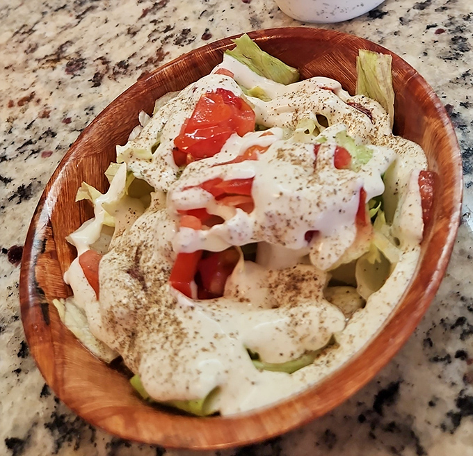 This isn't just salad&mdash;it's a cool, crisp counterpoint to burger indulgence, dressed with the kind of homemade touch that chain restaurants can only dream about.