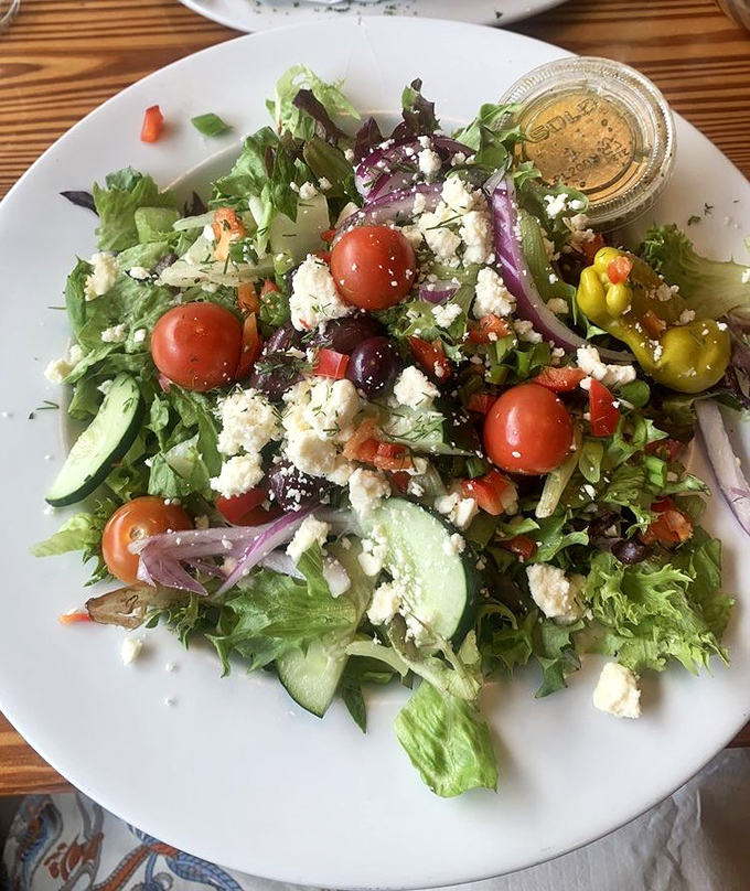 A Greek salad that brings freshness to the table &ndash; crisp greens, vibrant tomatoes, and feta that tastes like it just arrived from Athens.