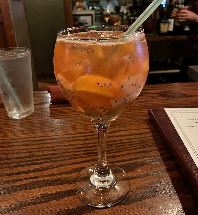 A sangria that captures summer in a glass &ndash; fruity, refreshing, and dangerously easy to enjoy while planning your next meal here.