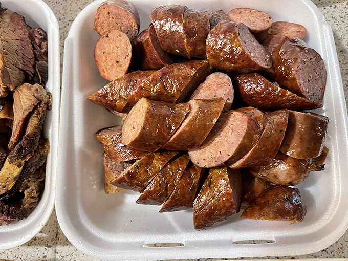 Sausage slices glistening with smoky promise—each one a perfect circle of spiced, meaty joy that would make a Texan weep.