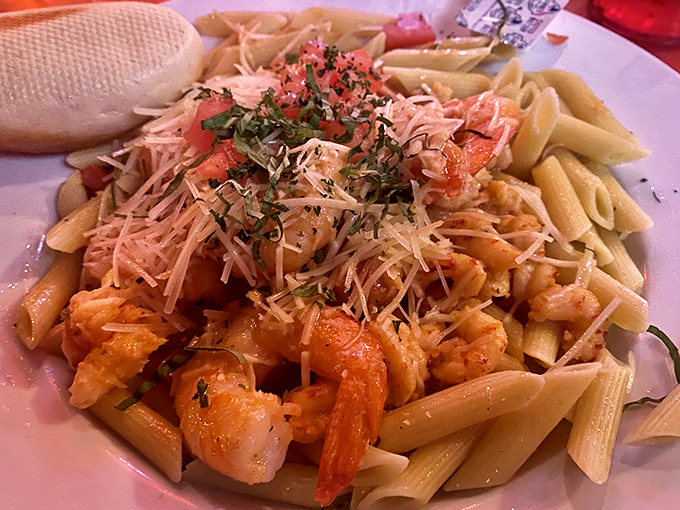 Penne pasta becomes a canvas for plump shrimp, fresh herbs, and just enough Parmesan—comfort food that somehow feels like a special occasion.