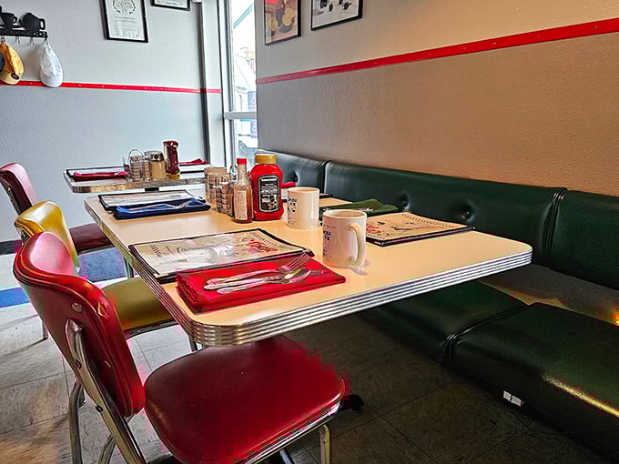 Green booth seating and colorful chairs create the perfect backdrop for breakfast diplomacy&mdash;where pancake treaties are negotiated over coffee.
