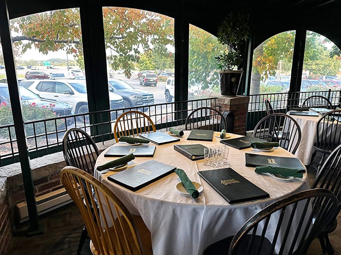 Window-side dining with a view and anticipation. Those perfectly set tables await their moment to host the next memorable meal at Annie Gunn's.