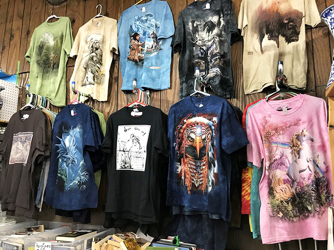 T-shirts hang like wearable art gallery pieces, each design telling its own unique and colorful story.